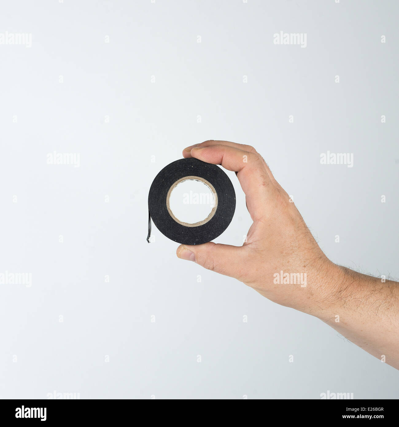 black Insulating tape in the hand Stock Photo - Alamy