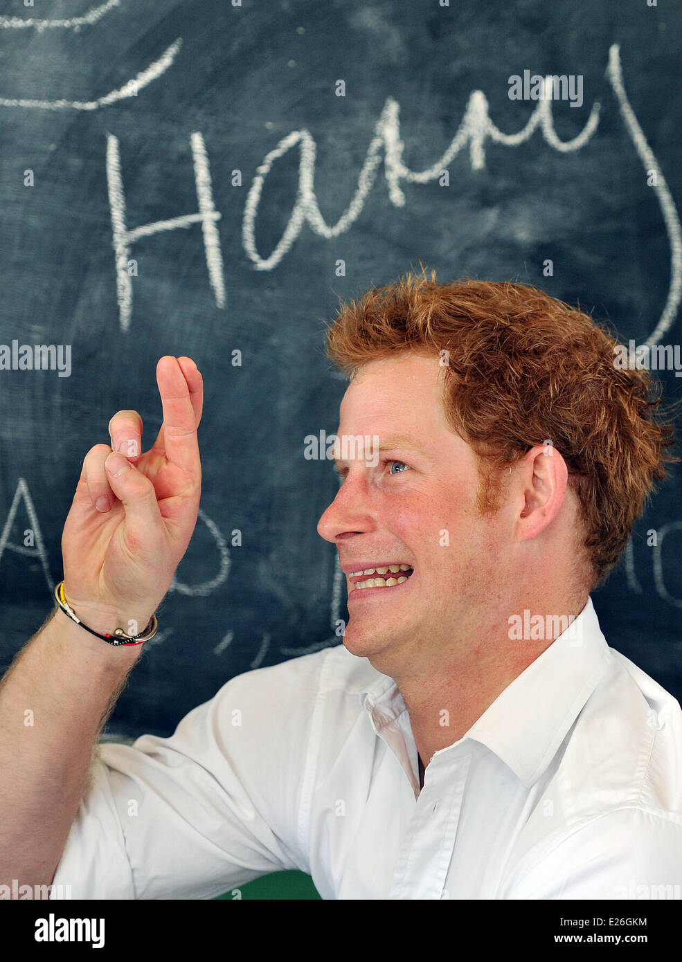 Prince Harry tries his hand at sign sign language in a class at the ...