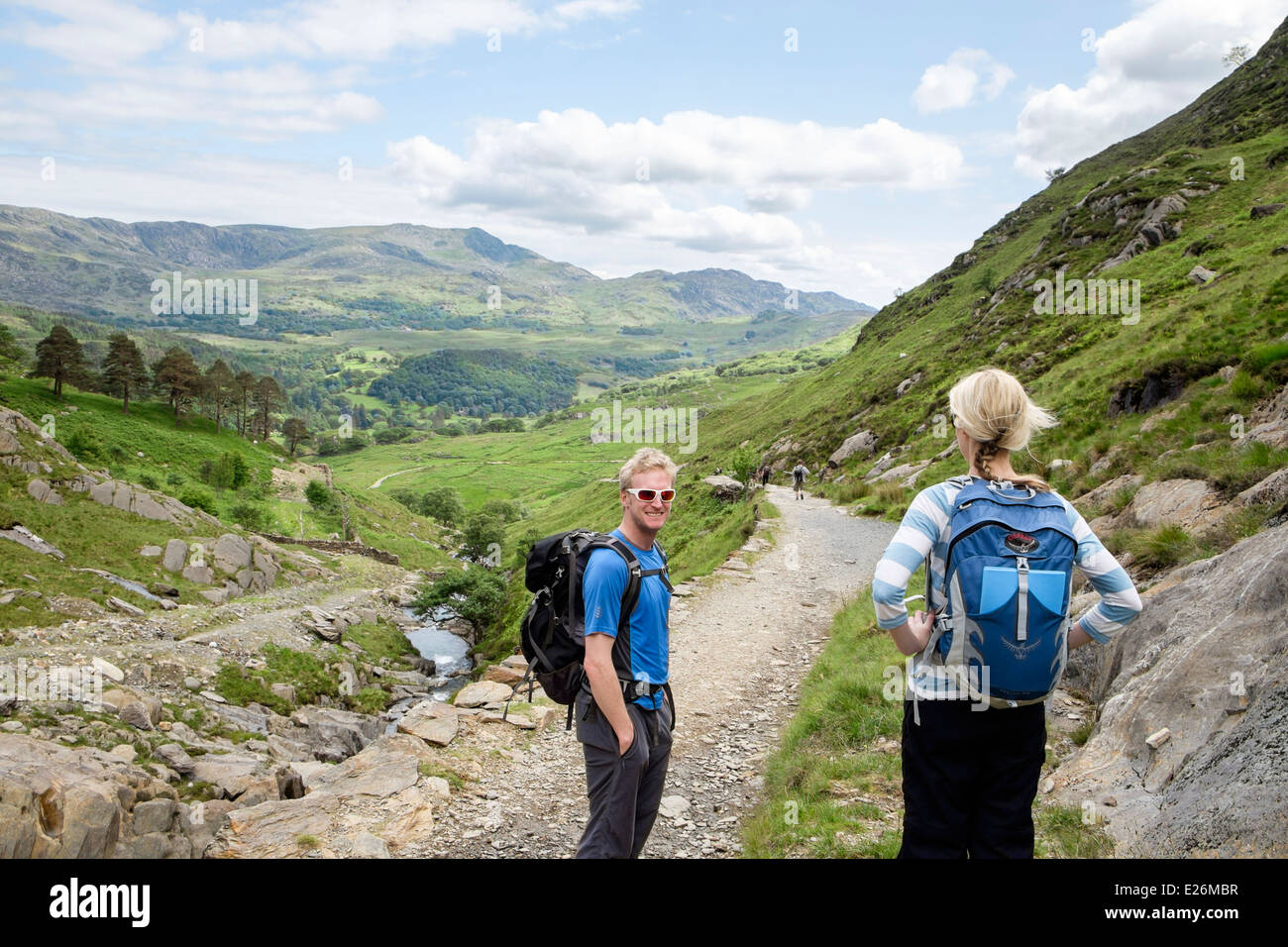 Two Millennial hikers descending lower slopes of the Watkin Path in ...