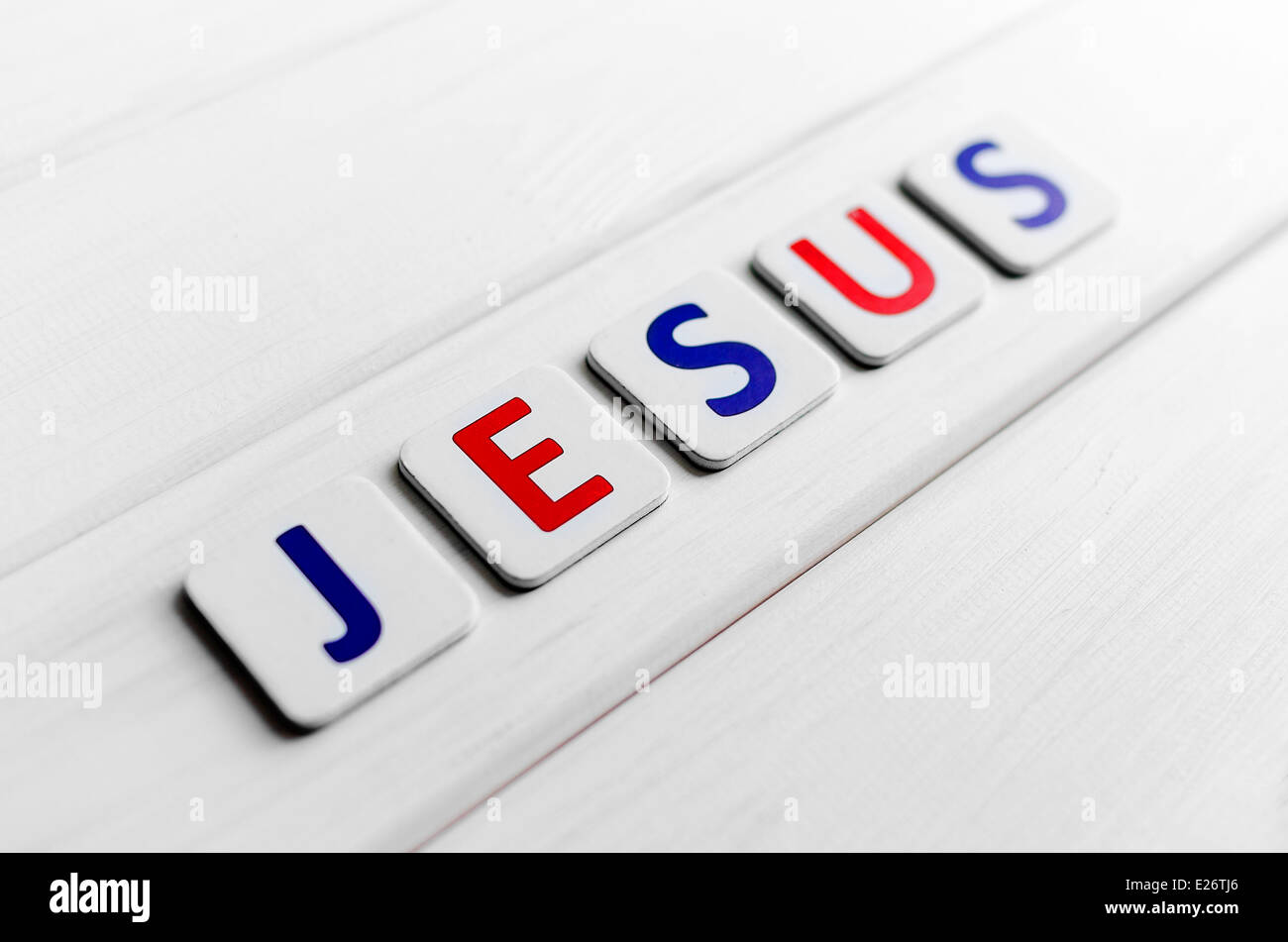 Jesus word composed of letters on a background of wood Stock Photo - Alamy
