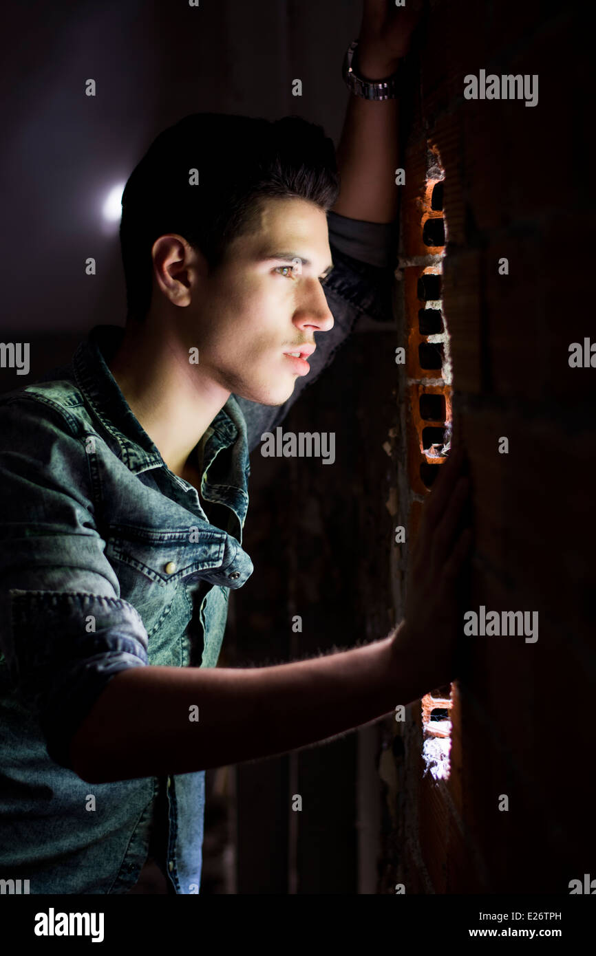 Man spying through hole in hi-res stock photography and images - Alamy