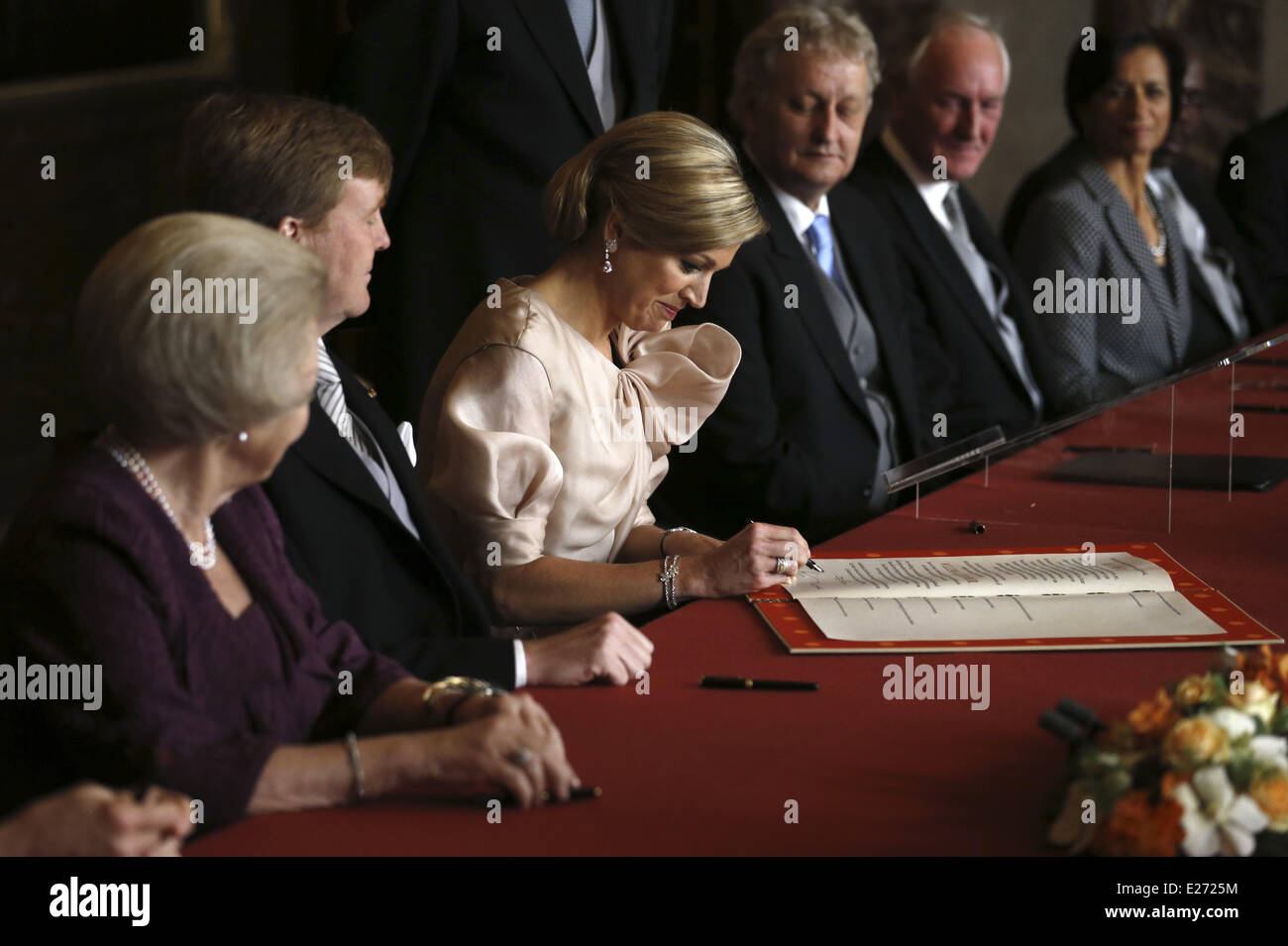 Queen Beatrix signs the Act of Abdication in favour of her son, Prince ...