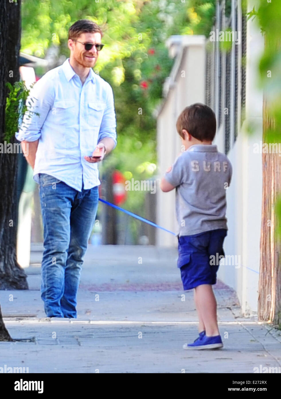 Xabi Alonso and his son Jontxu take their dog for a walk in Madrid ...