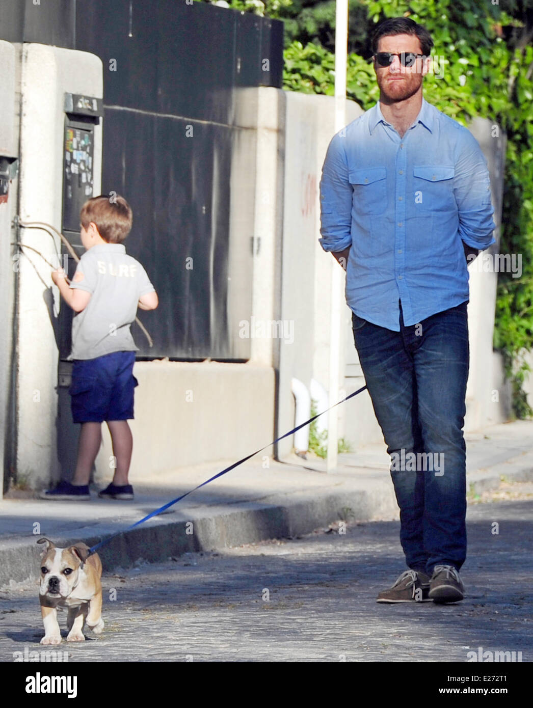 Xabi Alonso and his son Jontxu take their dog for a walk in Madrid ...