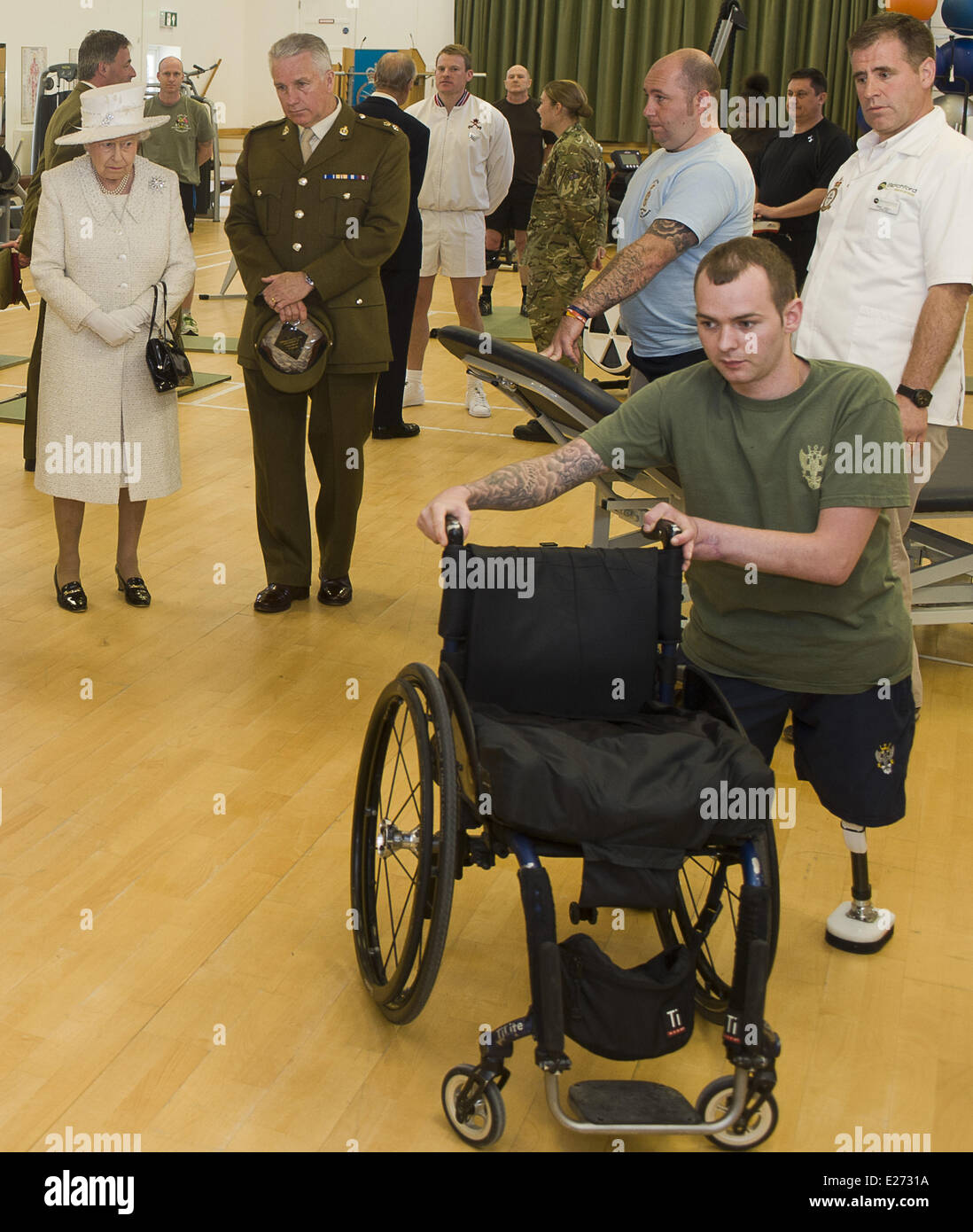 Britain's HM The Queen and HRH The Duke of Edinburgh visiting patients ...