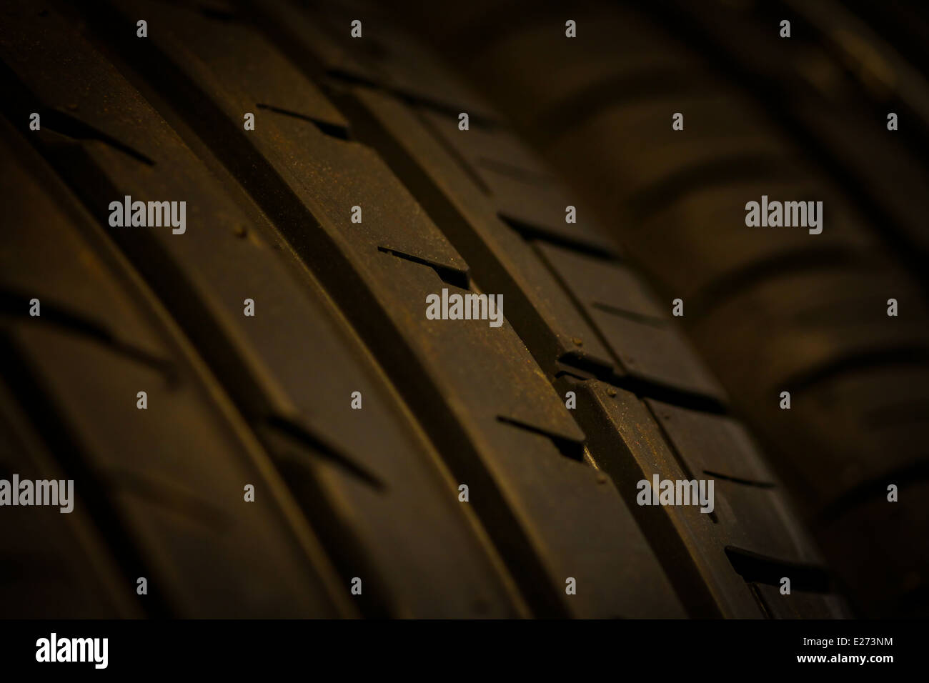 Detail of a car tire, on black Stock Photo - Alamy