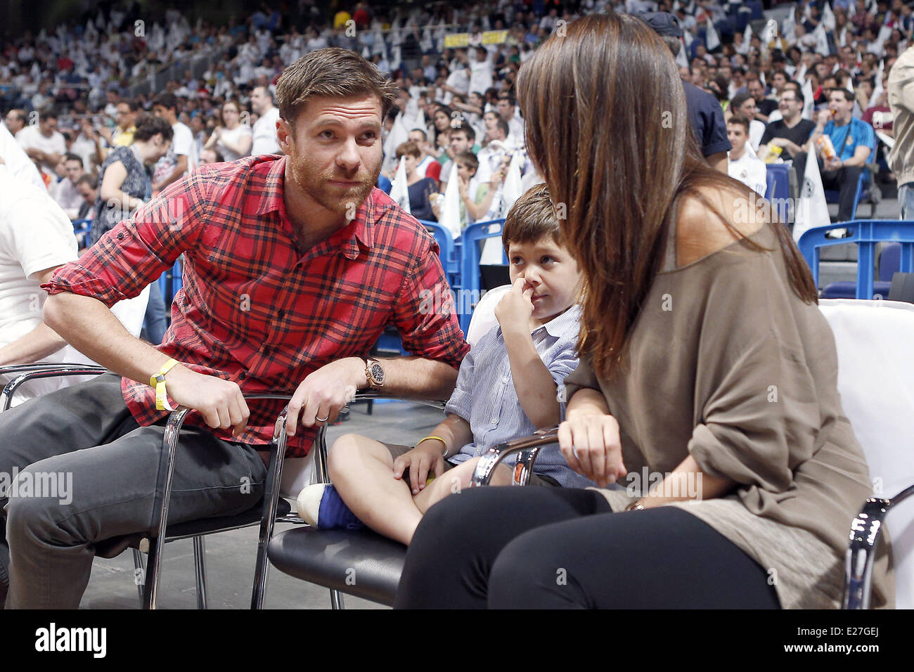 Real Madrid Midfielder Xabier Alonso and his family watch a basketball ...