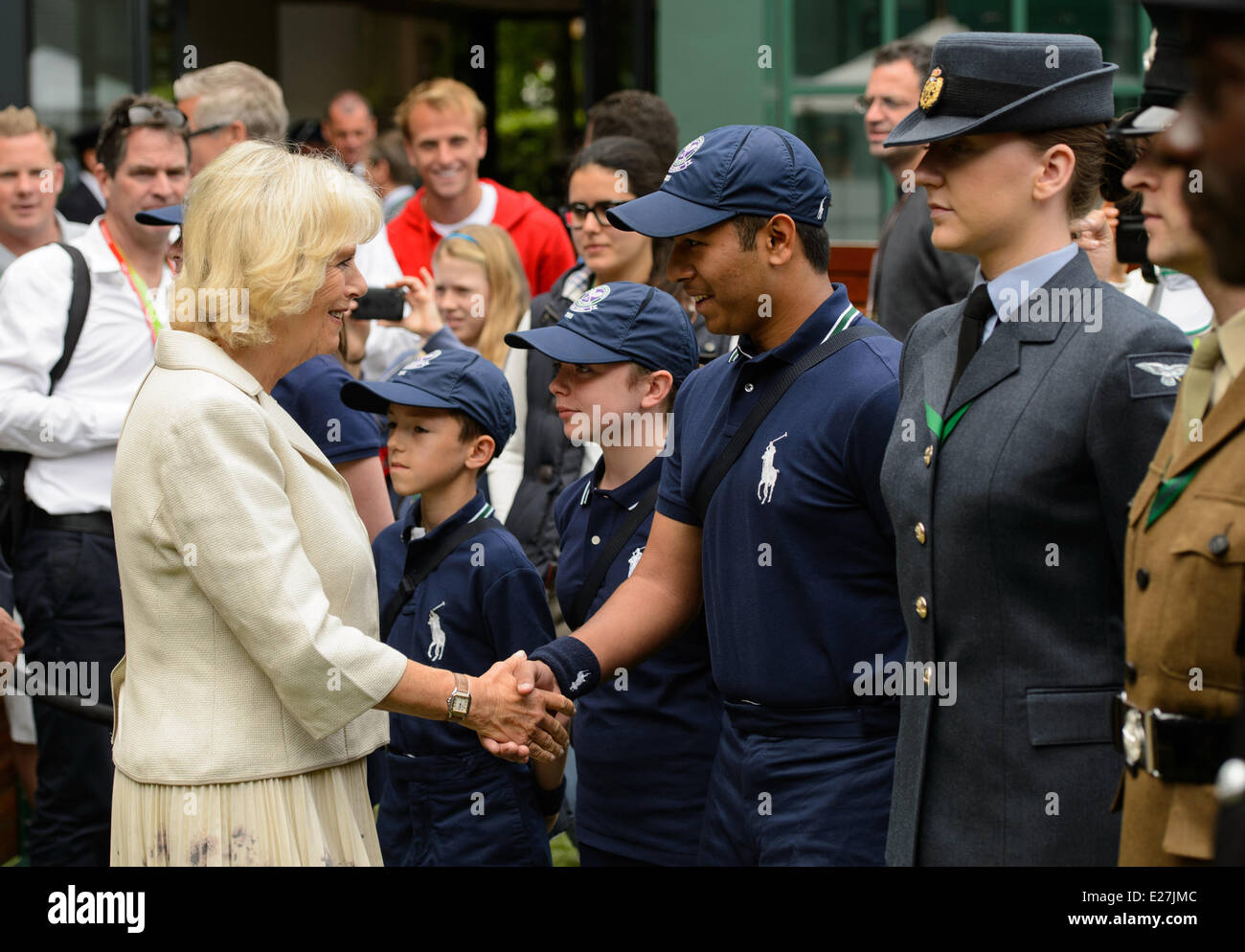 Britain's Camilla, The Duchess of Cornwall meets ballboy Dhilan Patel during a visit to the ...