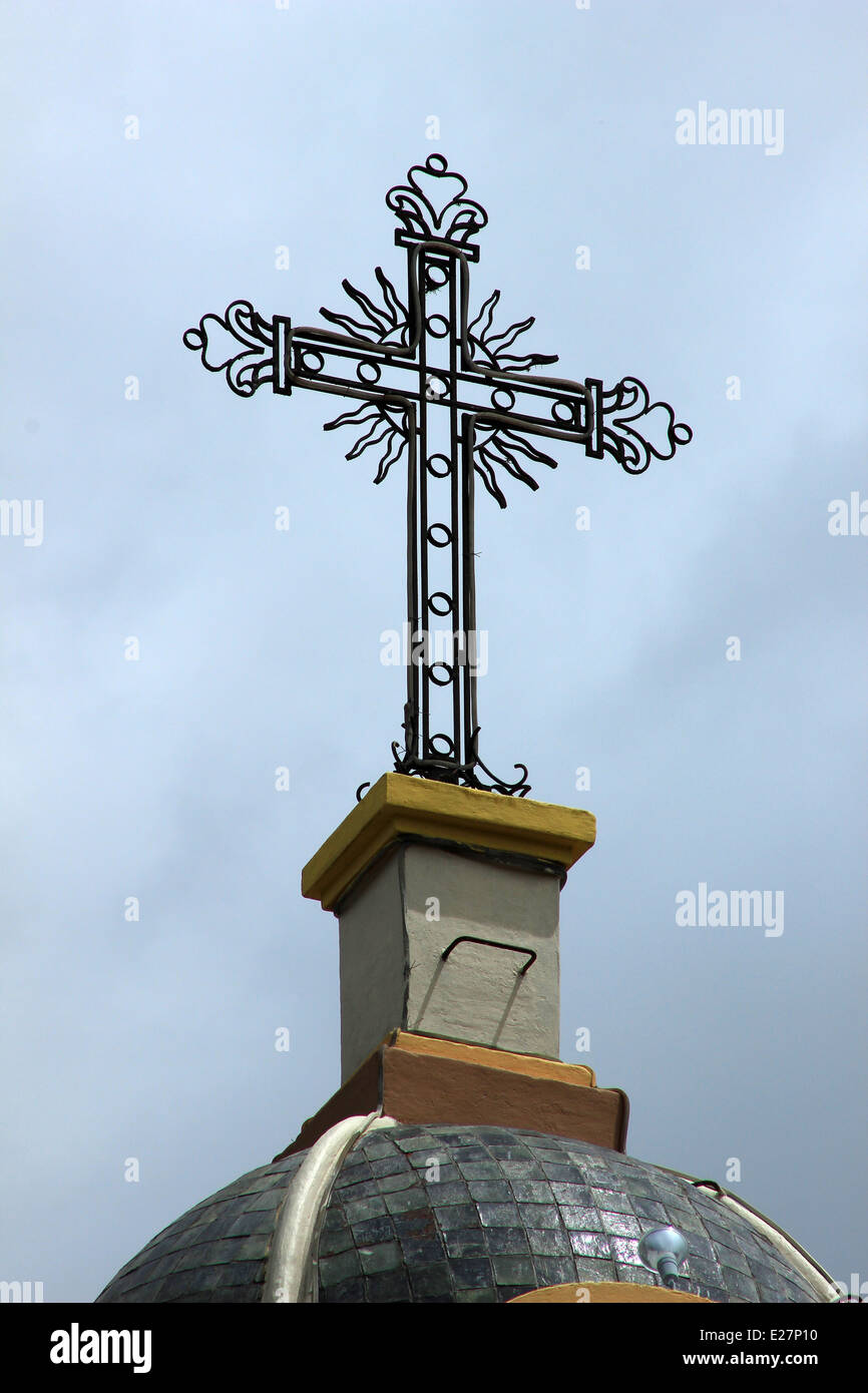 The cross on a dome of the Catholic church in Atuntaqui, Ecuador Stock ...