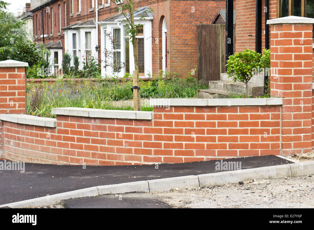 A newly built brick wall at the front of a property Stock Photo - Alamy