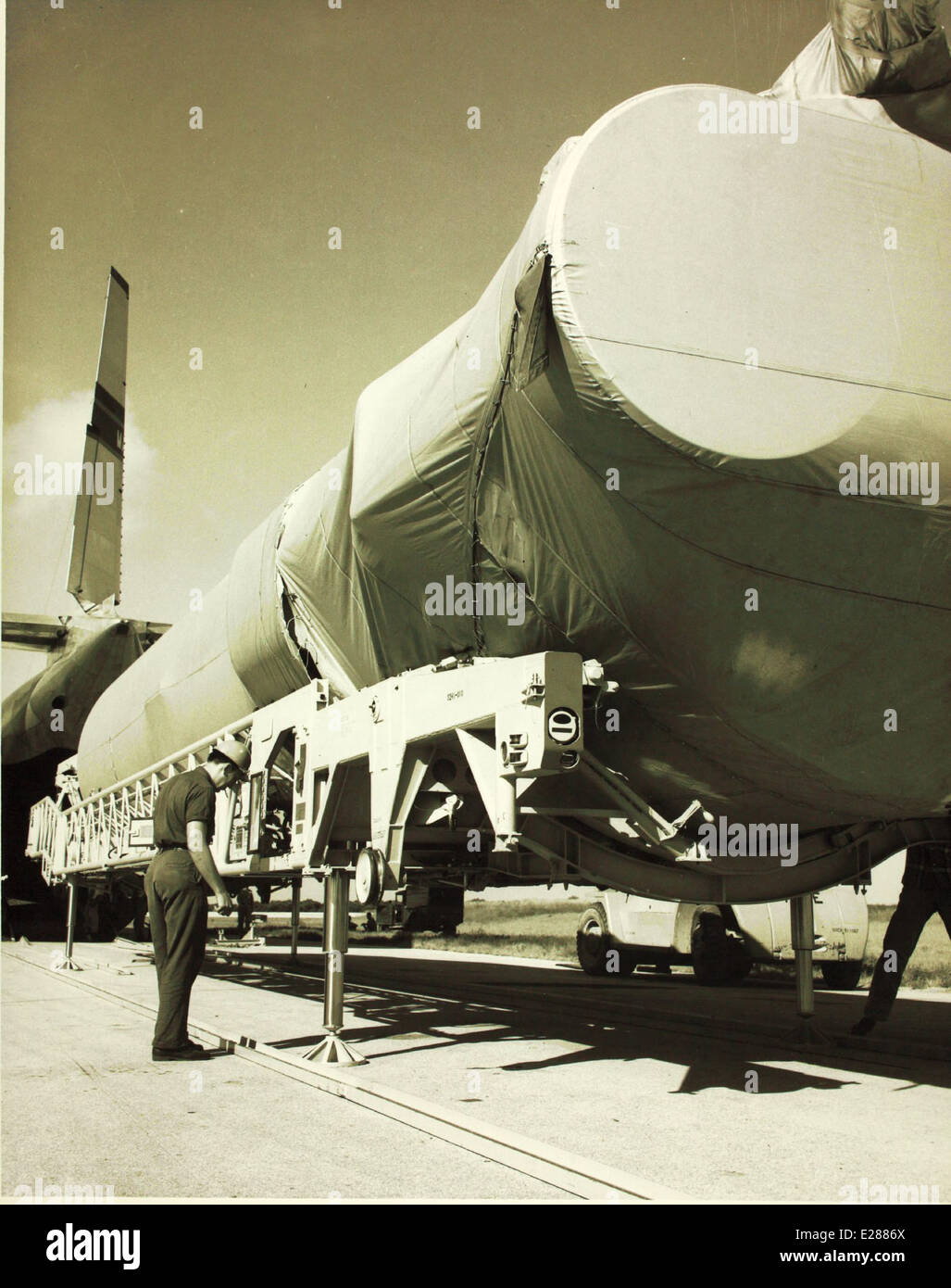 The Convair/General Dynamics Atlas 3E missile is seen being unloaded at ...