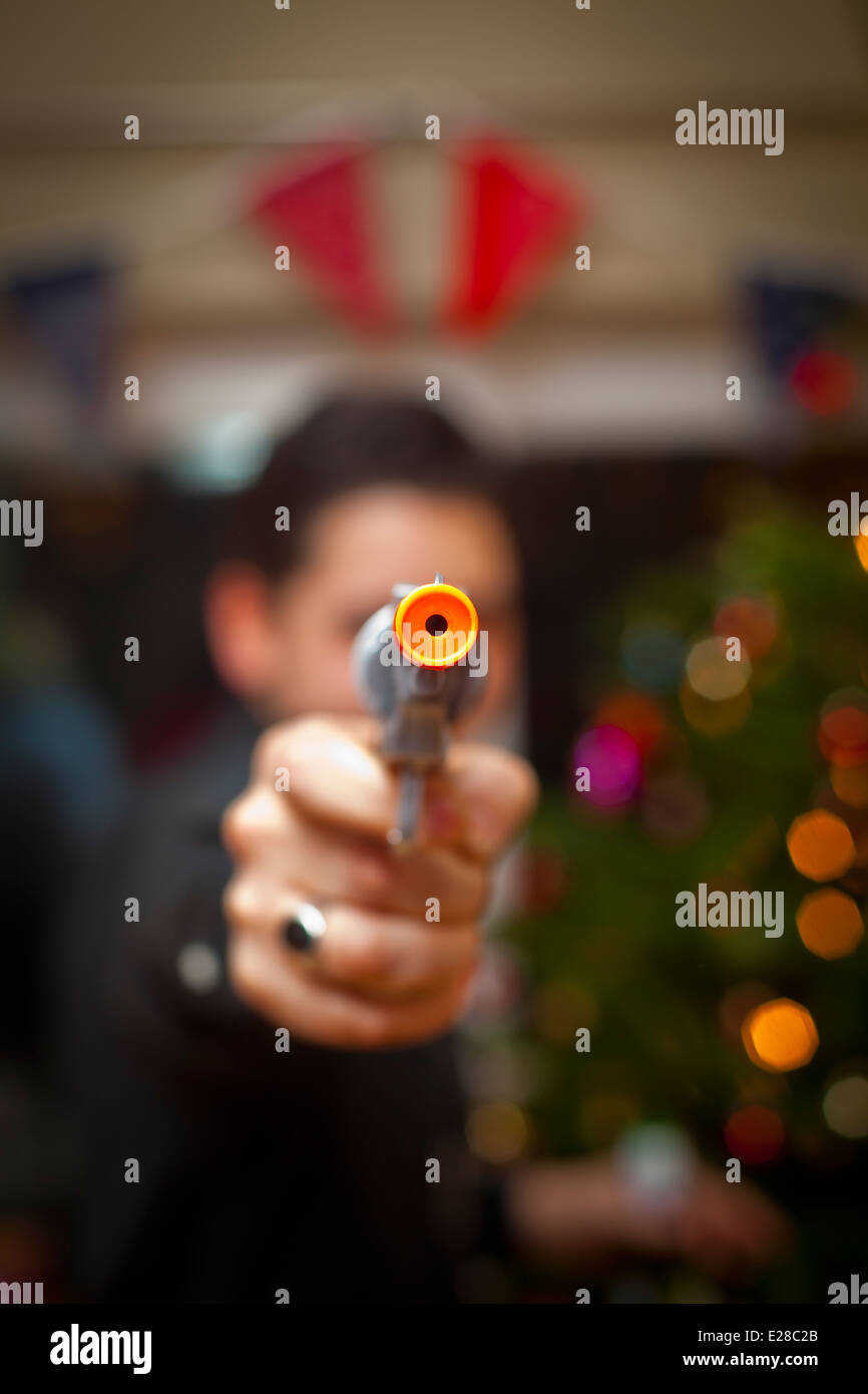 Man pointing aiming toy gun Stock Photo - Alamy