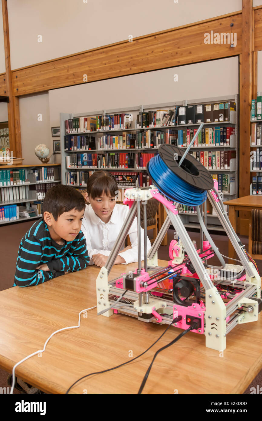 Looking closely at the 3D printer Stock Photo - Alamy