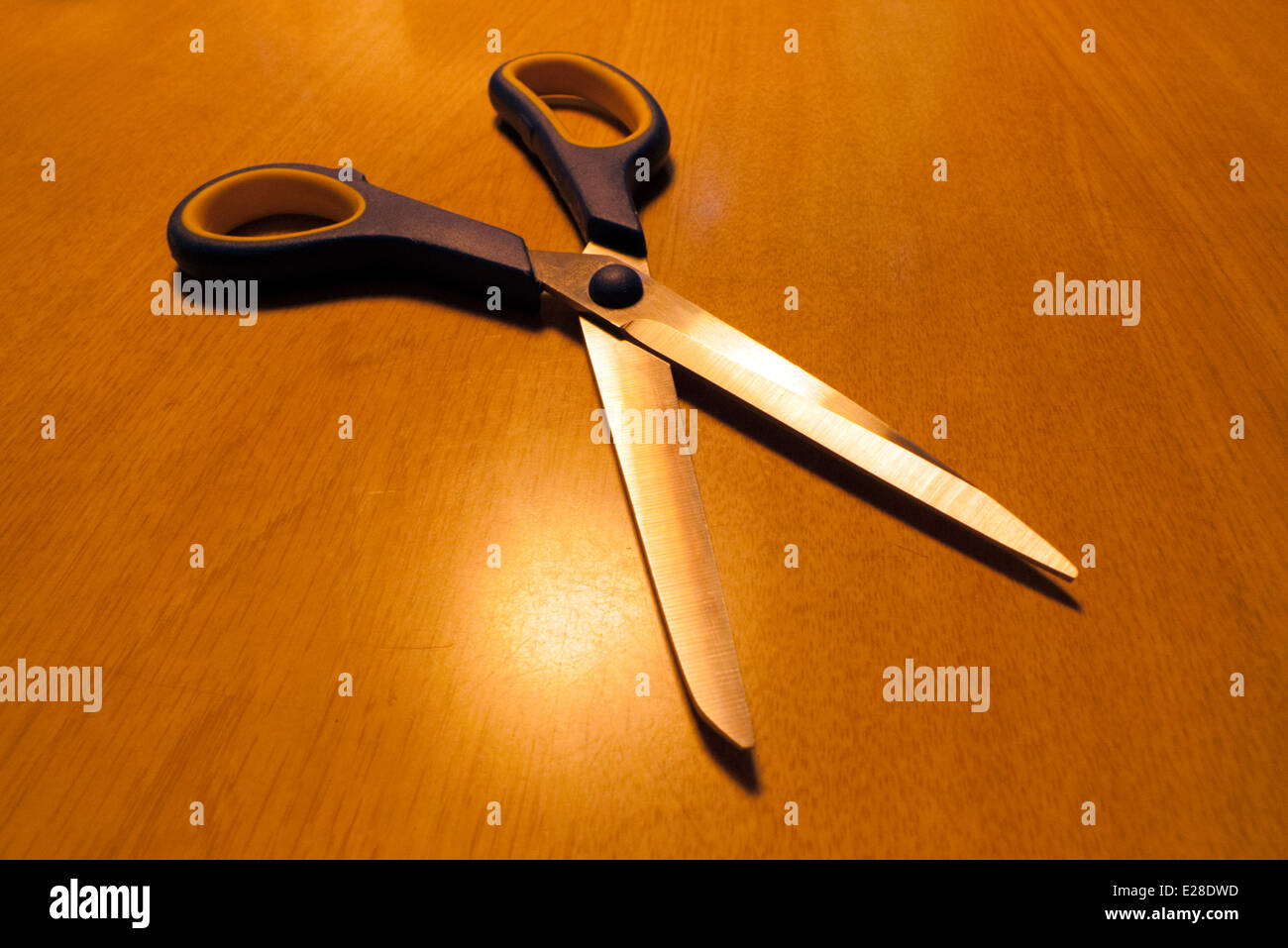 Scissors on tabletop Stock Photo - Alamy