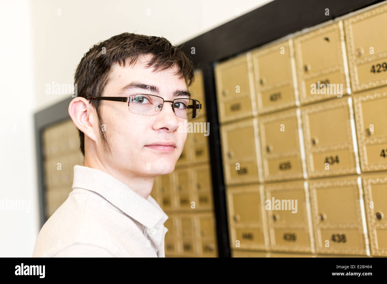 College student checking mail at mailboxed Stock Photo - Alamy
