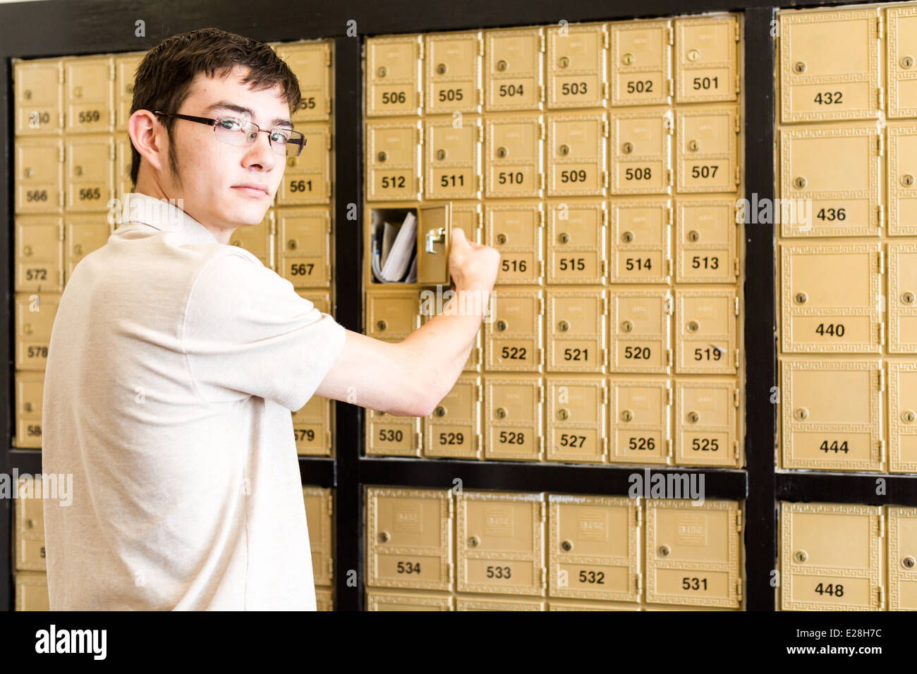 College student checking mail at mailboxed Stock Photo - Alamy