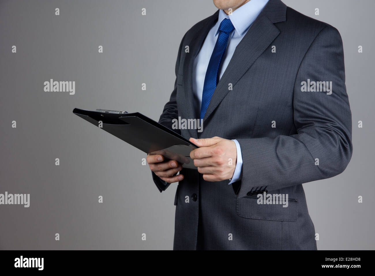 business man in a suit and tie holding folder with documents Stock ...