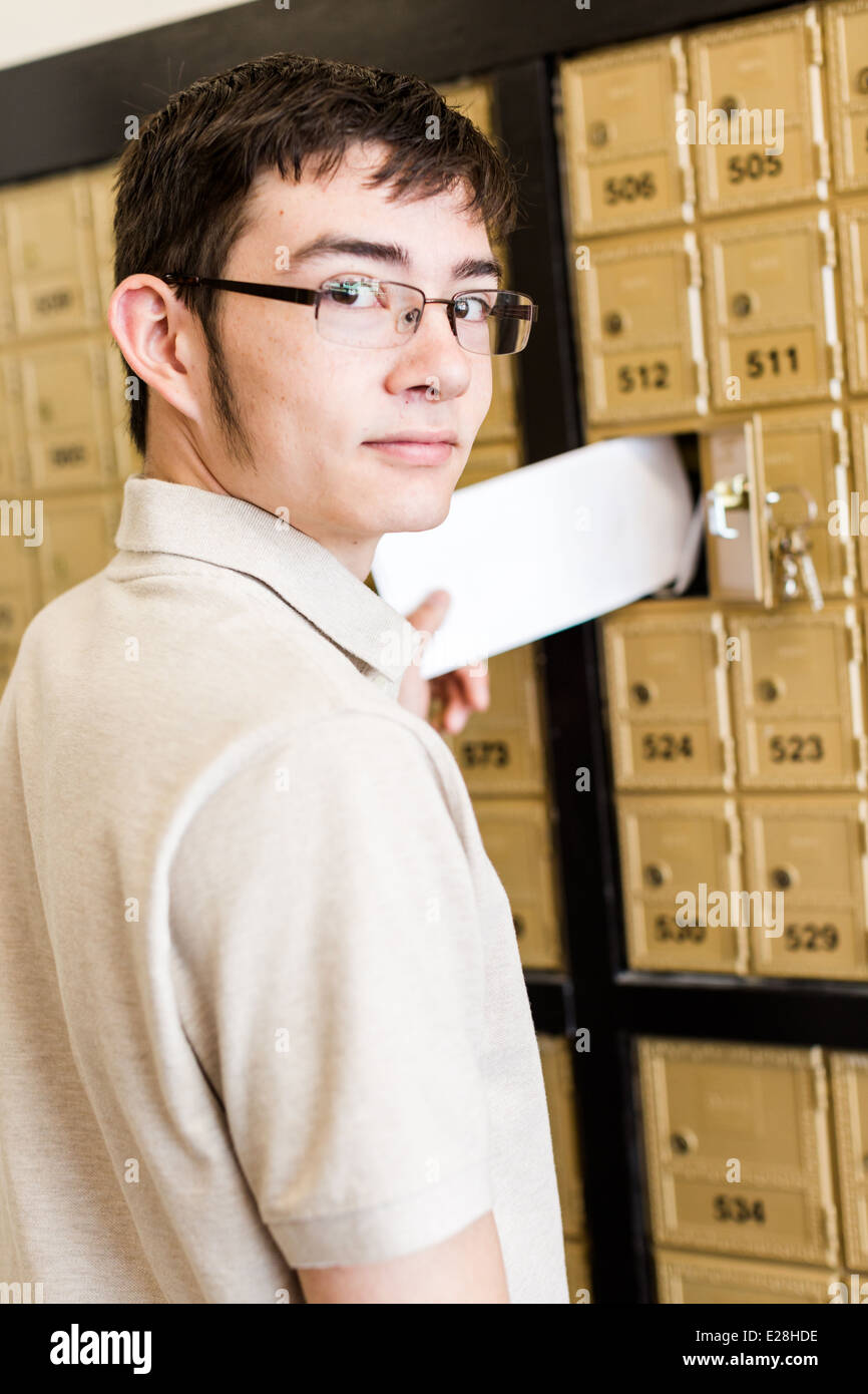 College student checking mail at mailboxed Stock Photo - Alamy