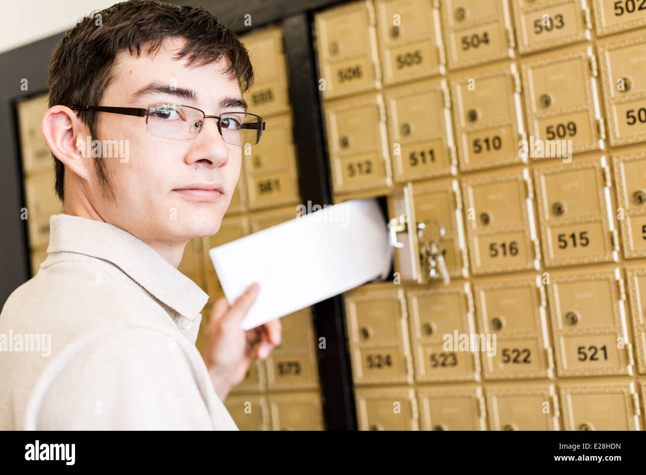 College student checking mail at mailboxed Stock Photo - Alamy