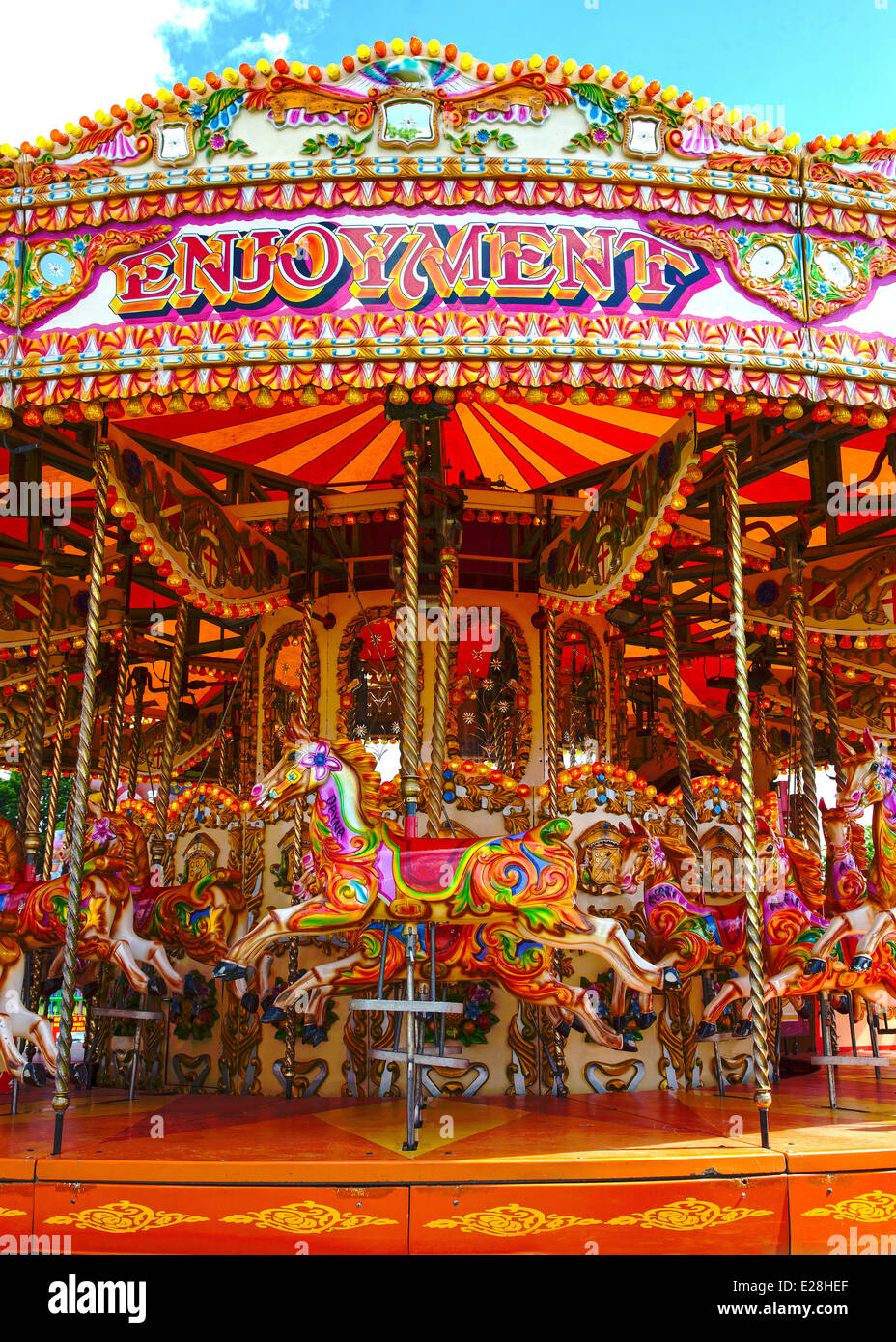 Old fashioned carousel fun fair ride Stock Photo - Alamy