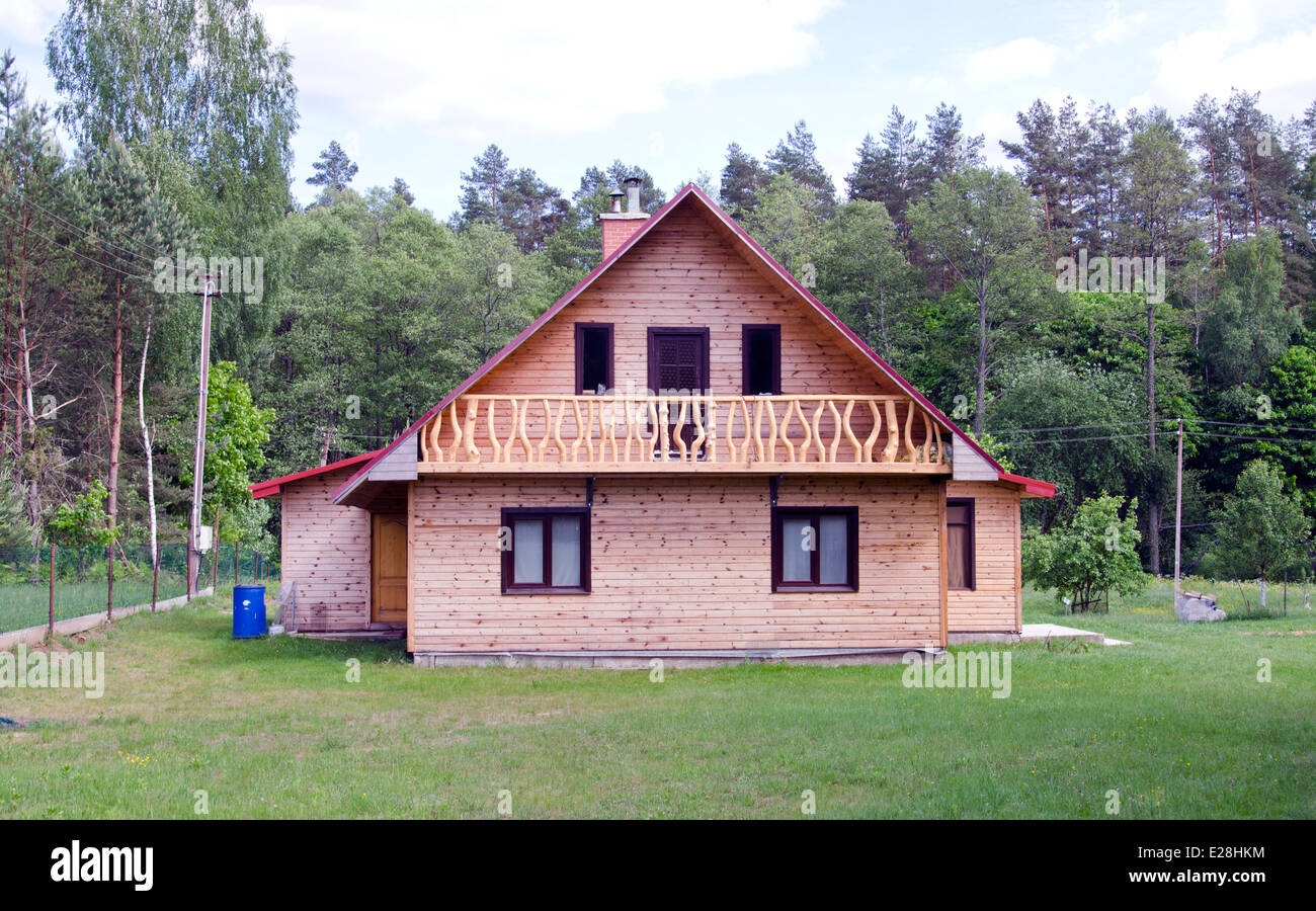 new wooden house construction in village Stock Photo - Alamy