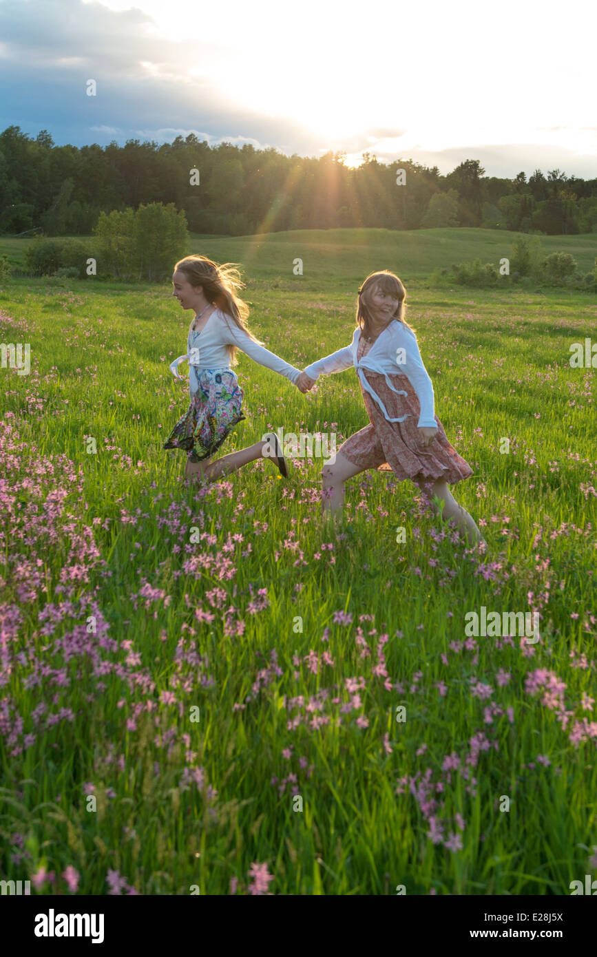 Two girls running hi-res stock photography and images - Alamy