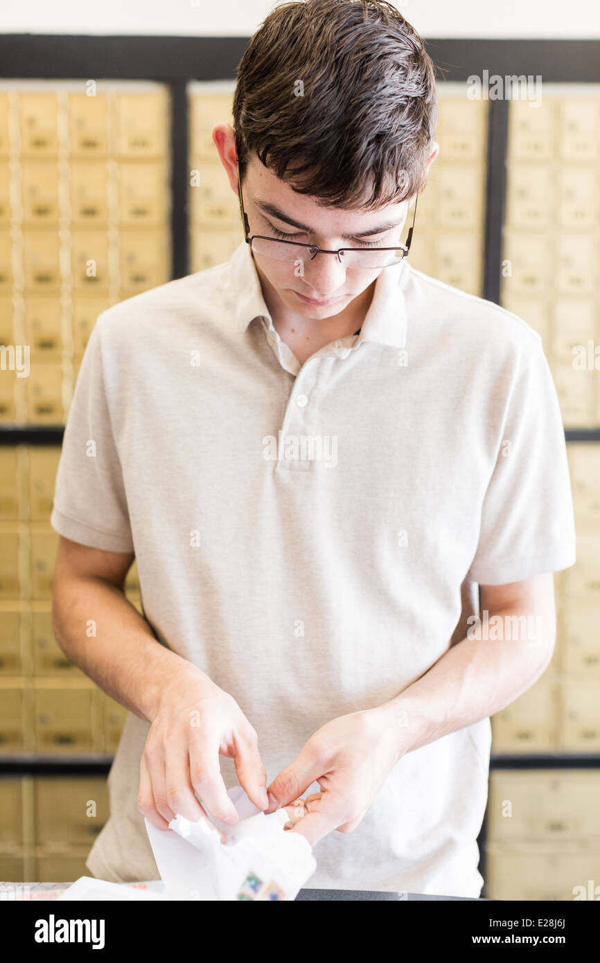College student checking mail at mailboxed Stock Photo - Alamy