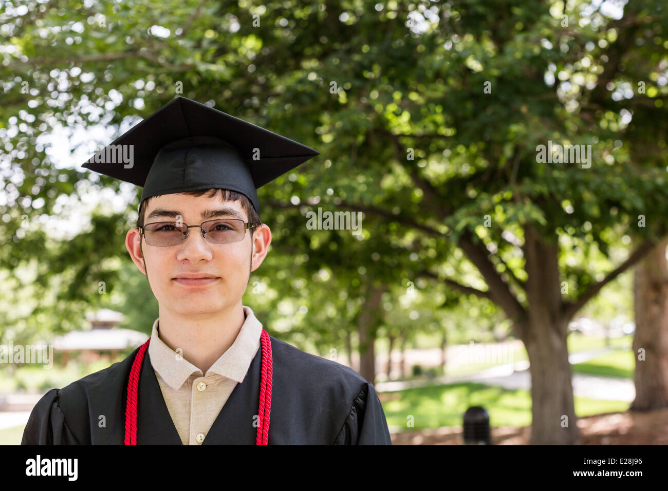 Highschool graduate after graduation caremony in the park Stock Photo ...