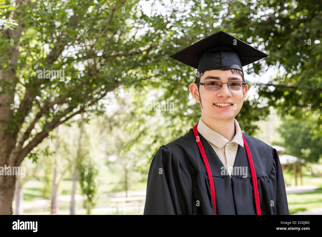 Highschool graduate after graduation caremony in the park Stock Photo ...