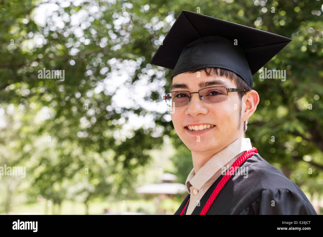 Highschool graduate after graduation caremony in the park Stock Photo ...