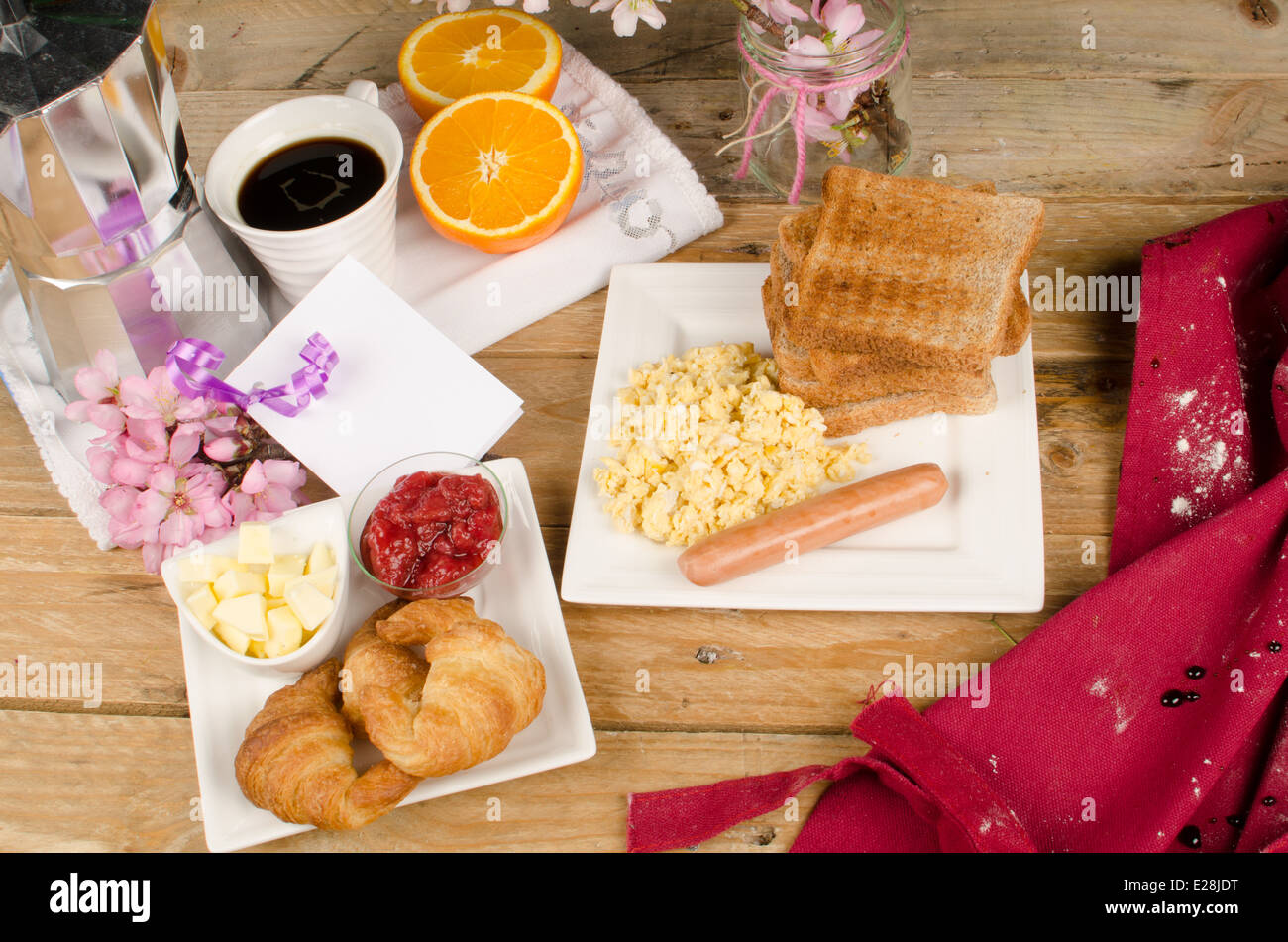 Messy breakfast table, a kid having it set up for its parents Stock ...