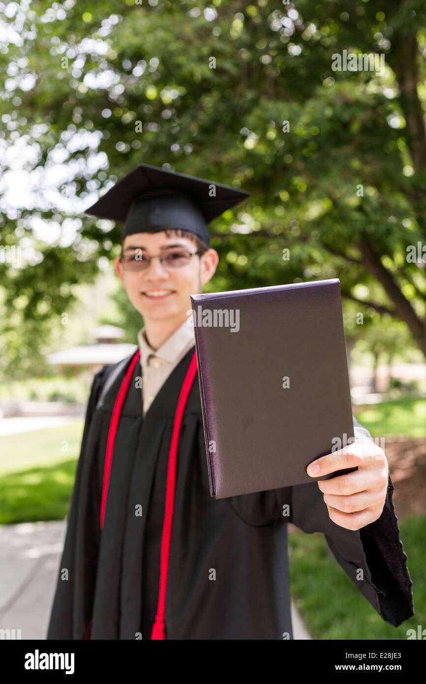 Highschool graduate after graduation caremony in the park Stock Photo ...