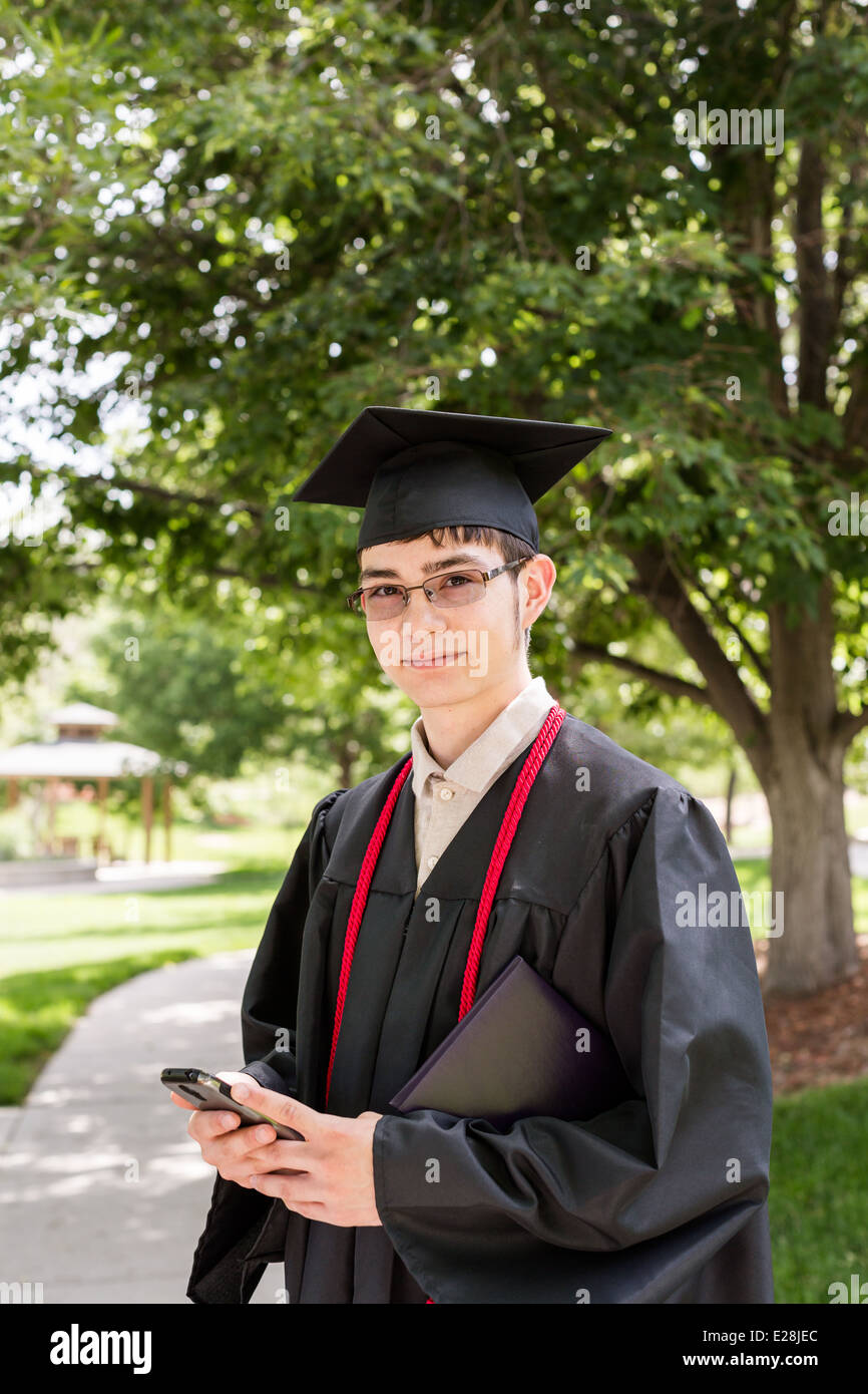 Highschool graduate after graduation caremony in the park Stock Photo ...