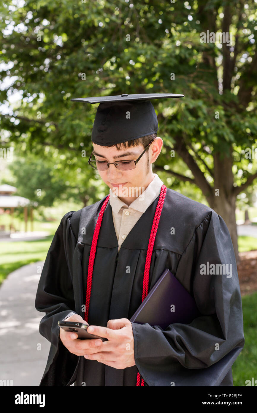 Highschool graduate after graduation caremony in the park Stock Photo ...