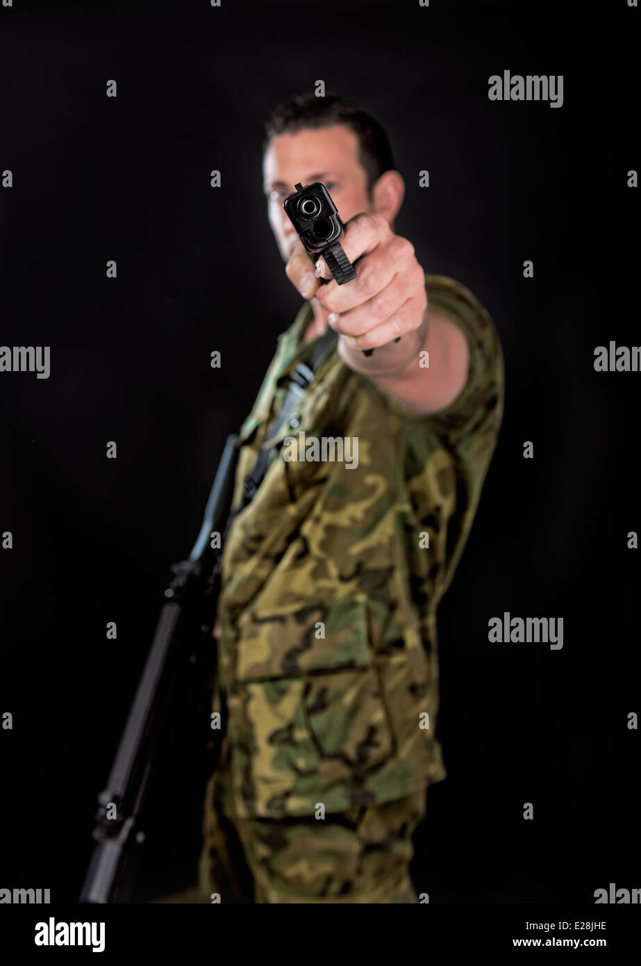 Spanish military with SMG and gun on black background Stock Photo - Alamy