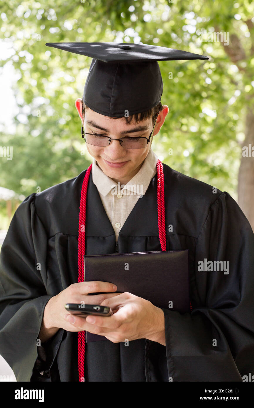 Highschool graduate after graduation caremony in the park Stock Photo ...