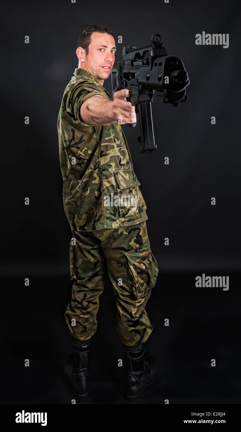 Spanish military with SMG on black background Stock Photo - Alamy