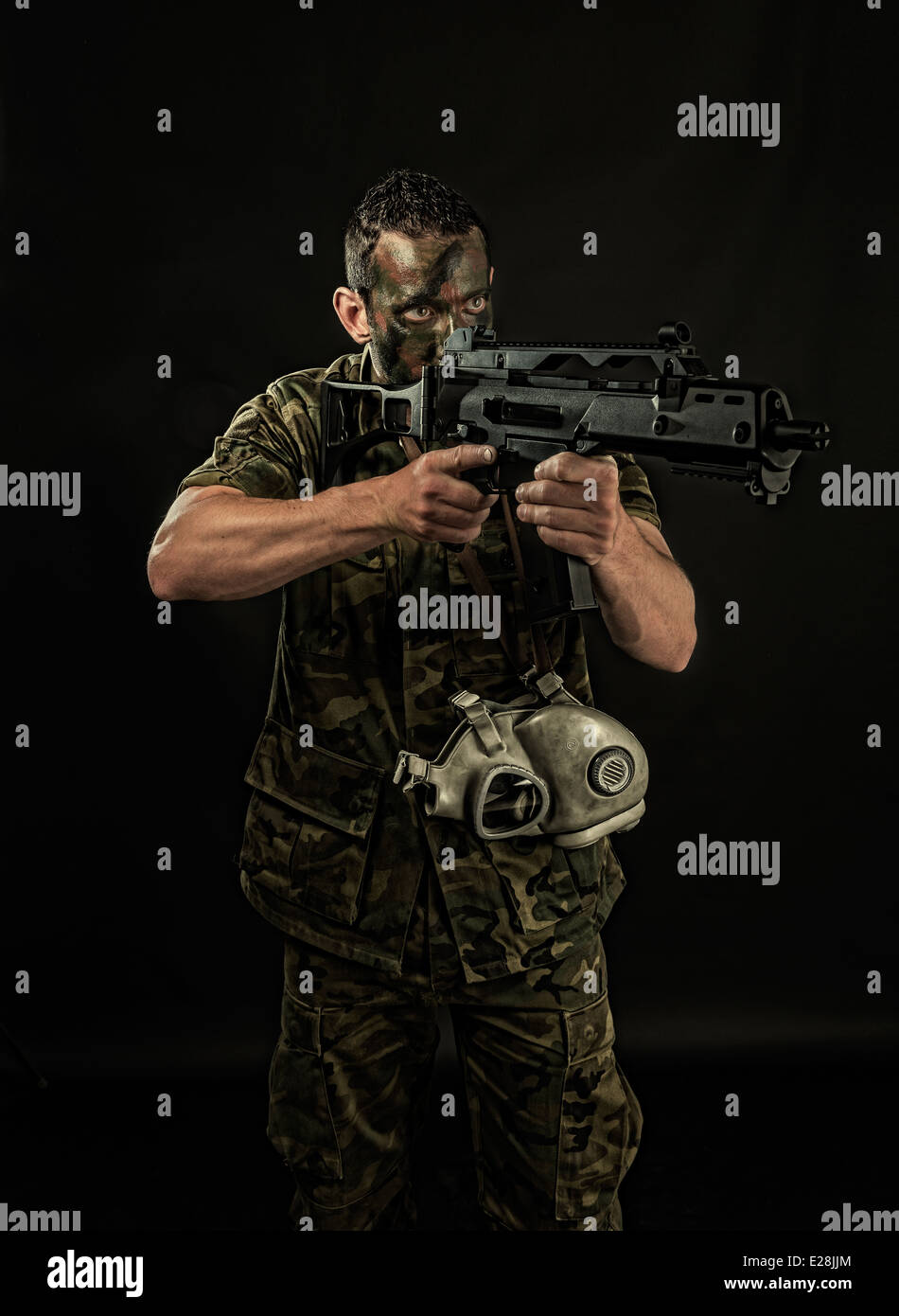 Spanish military with SMG on black background Stock Photo - Alamy