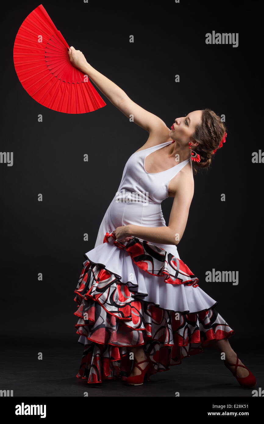 Flamenco dancer in white dress with big red fan Stock Photo - Alamy