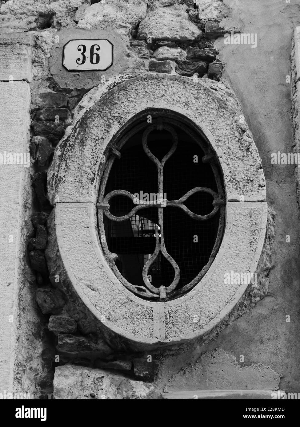 A close up of an old oval window without glass in black and white Stock ...