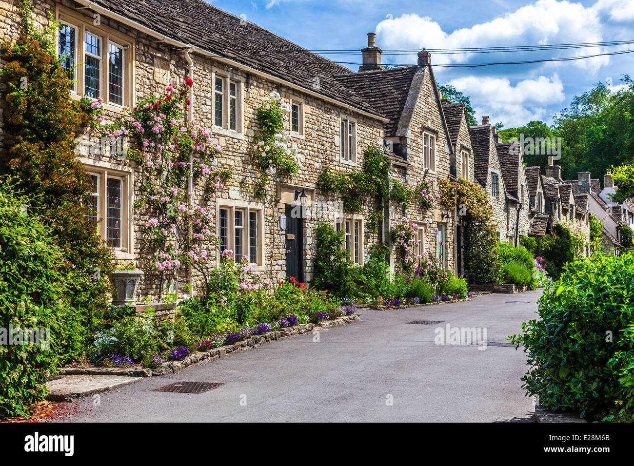 A lane of pretty terraced stone cottages in the Cotswold village of ...