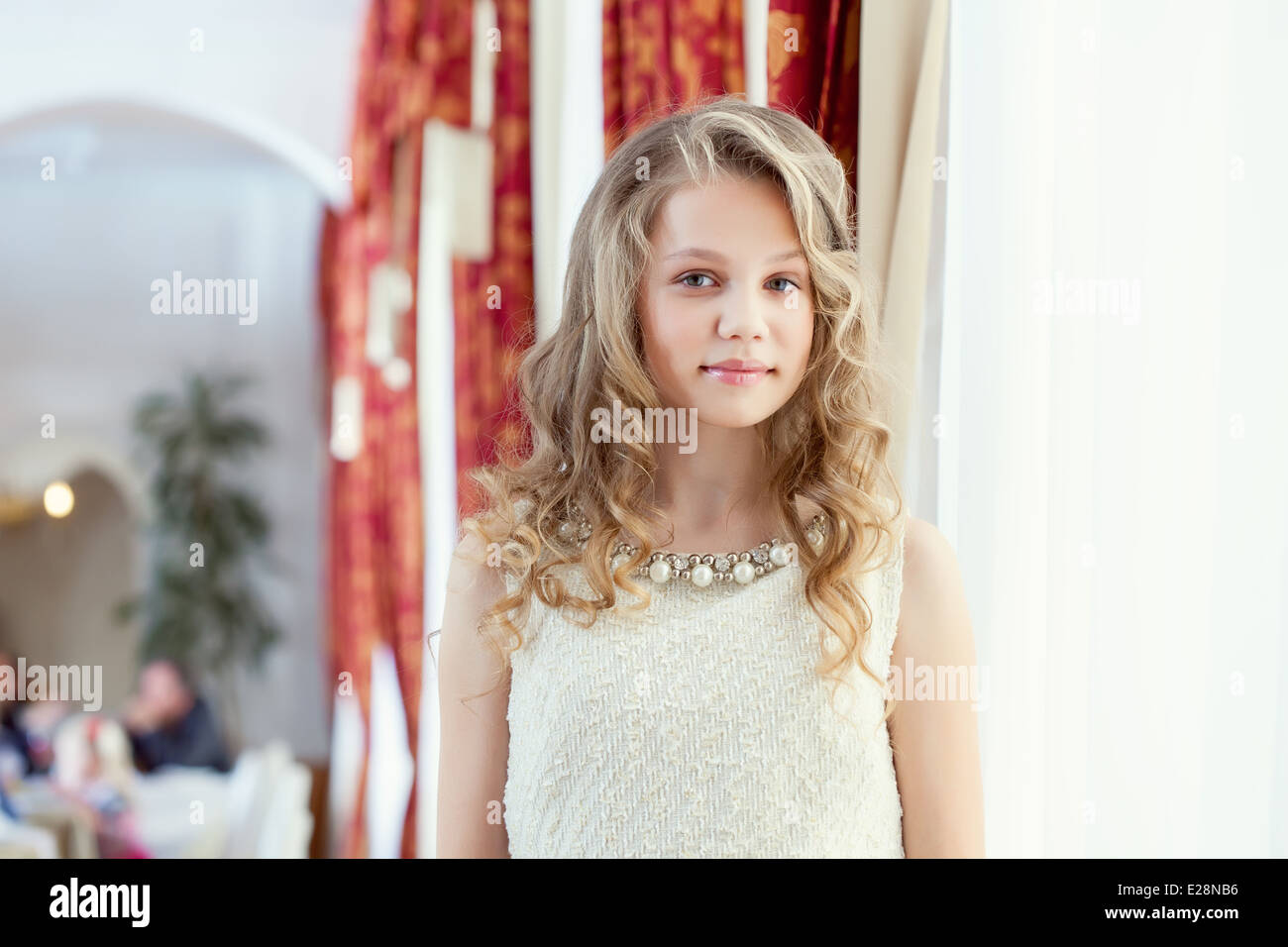 Image of pretty smiling girl posing in restaurant Stock Photo - Alamy