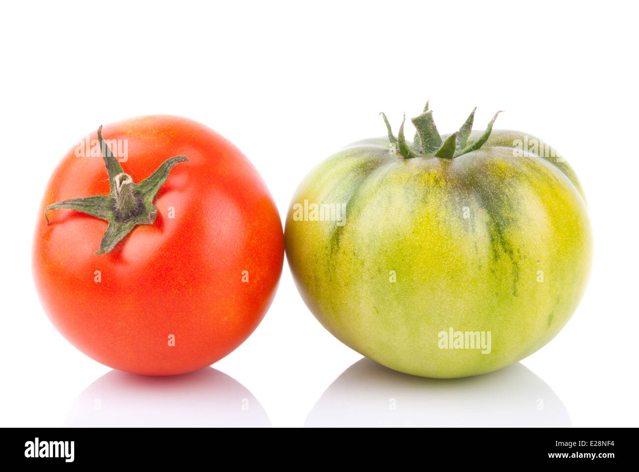 Two tomatoes isolated on white background Stock Photo - Alamy