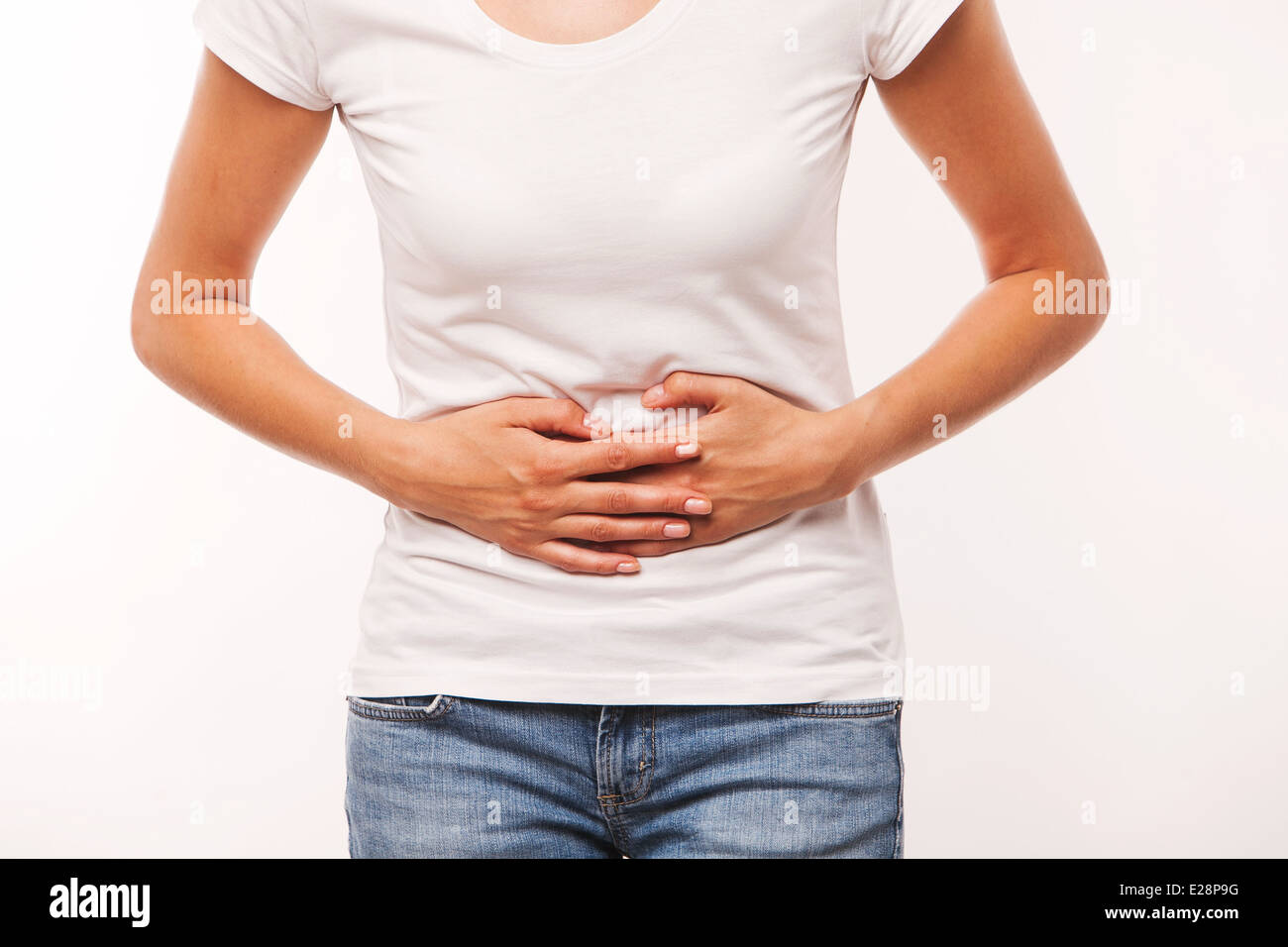 Woman heaving belly ache, on white background Stock Photo - Alamy