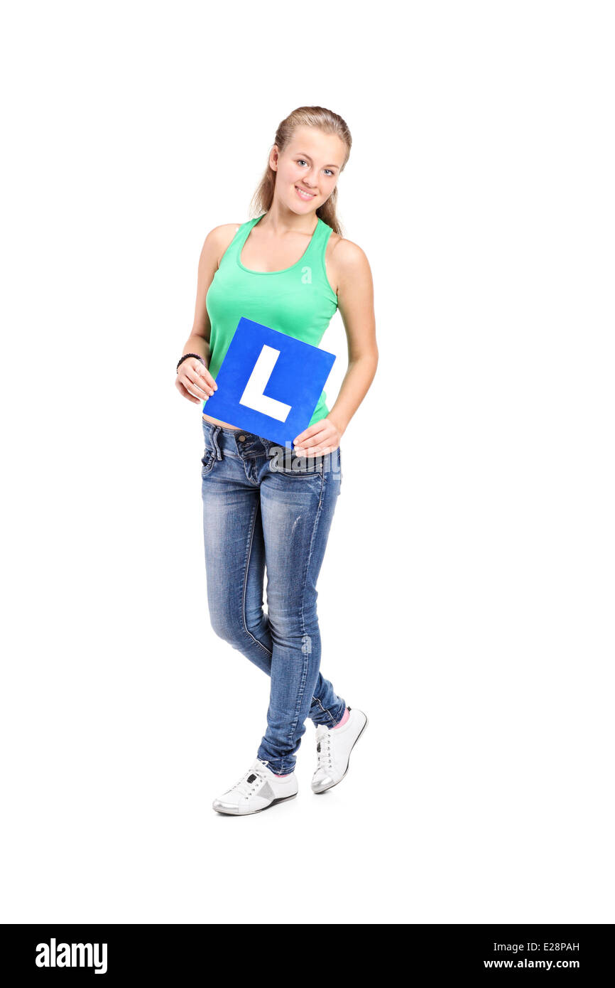 Full length portrait of a young girl holding an l sign Stock Photo - Alamy