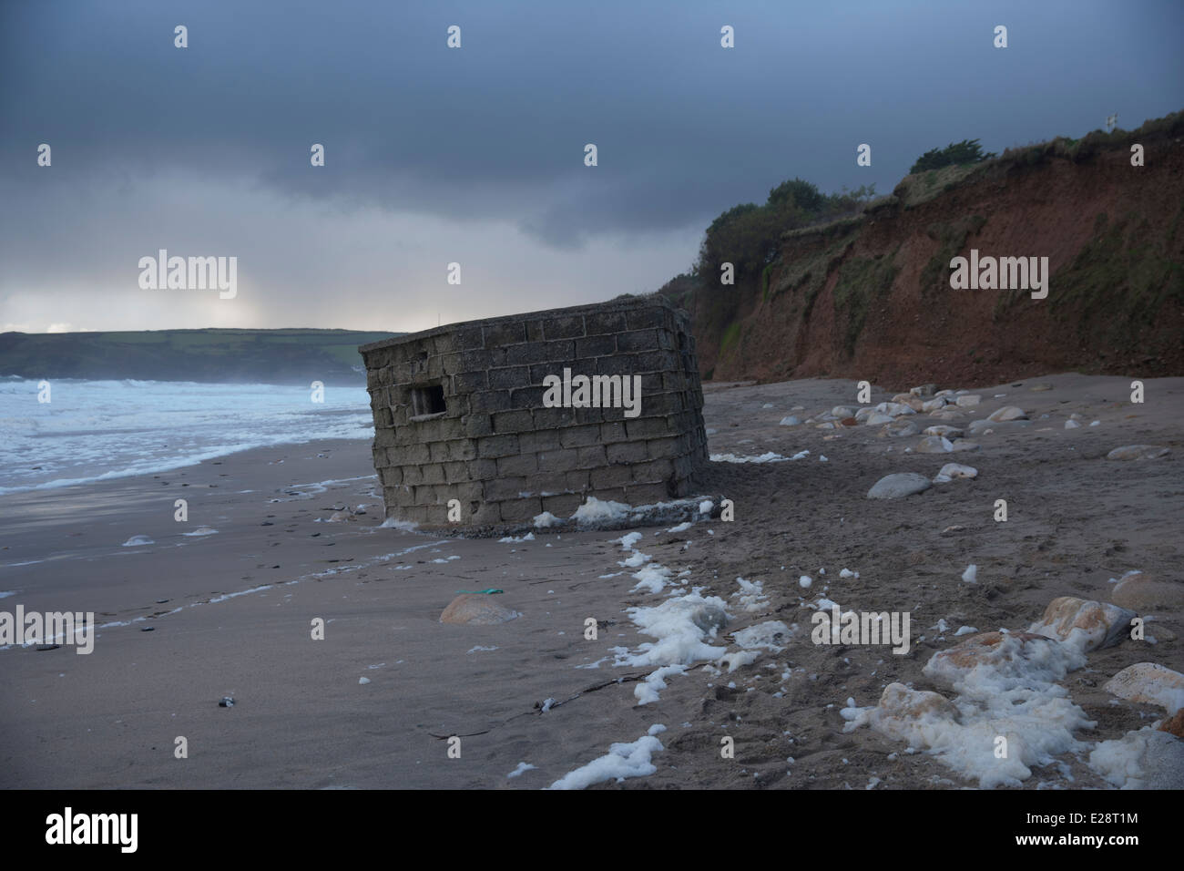 A world war 2 pill box is left sitting on the beach due to coastal ...