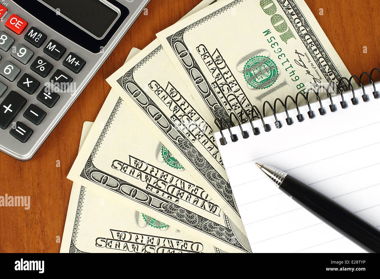 Money, calculator, notepad and pen on wooden background close-up Stock ...