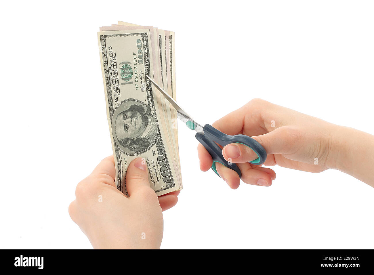 Woman hands cutting money on white background Stock Photo - Alamy