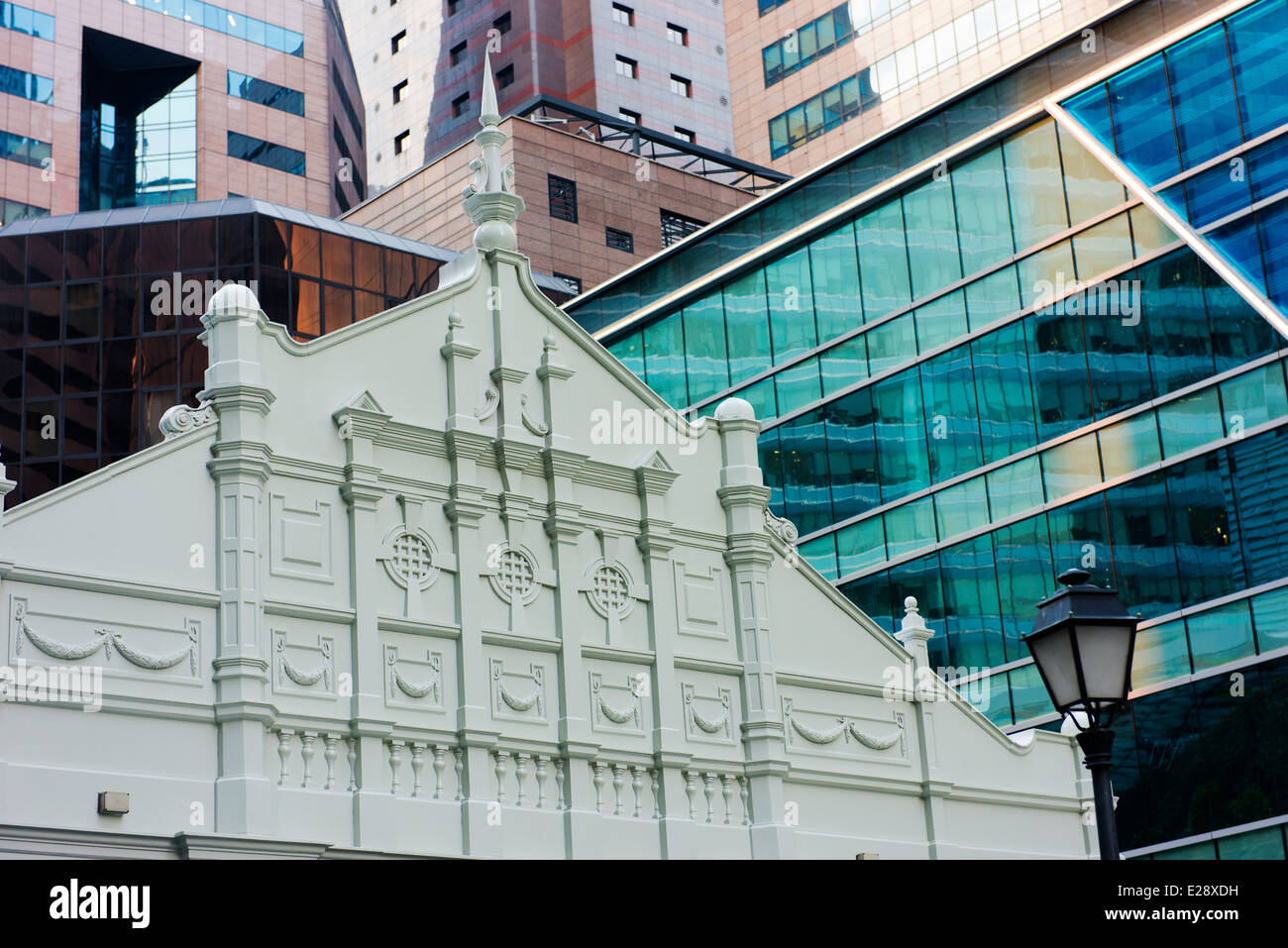 Restored colonial building facade surrounded by modern buildings in ...