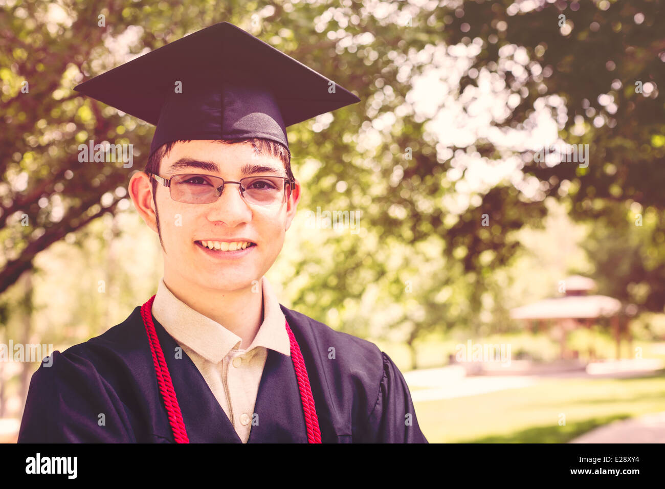 Highschool graduate after graduation caremony in the park Stock Photo ...